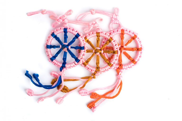 Dharma Wheel Charms - Tibetan Nuns Project